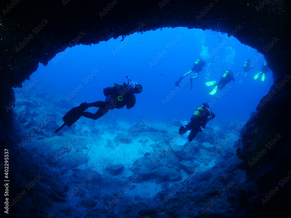 cave diving underwater scuba divers exploring caves and having fun ...