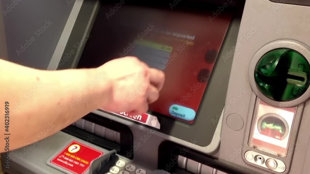 Man depositing cheque at ATM machine inside Cibc bank Stock Video ...