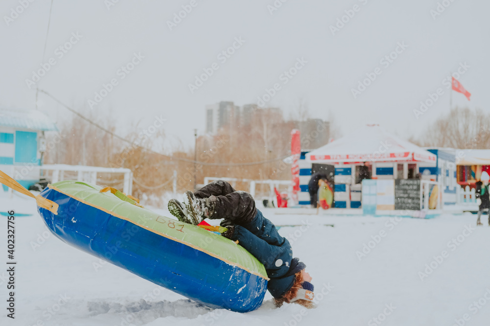 safety equipment on slides. The child falls from the sled. Falling ...