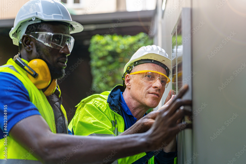 factory worker technician engineer men showing and checking solar cell ...