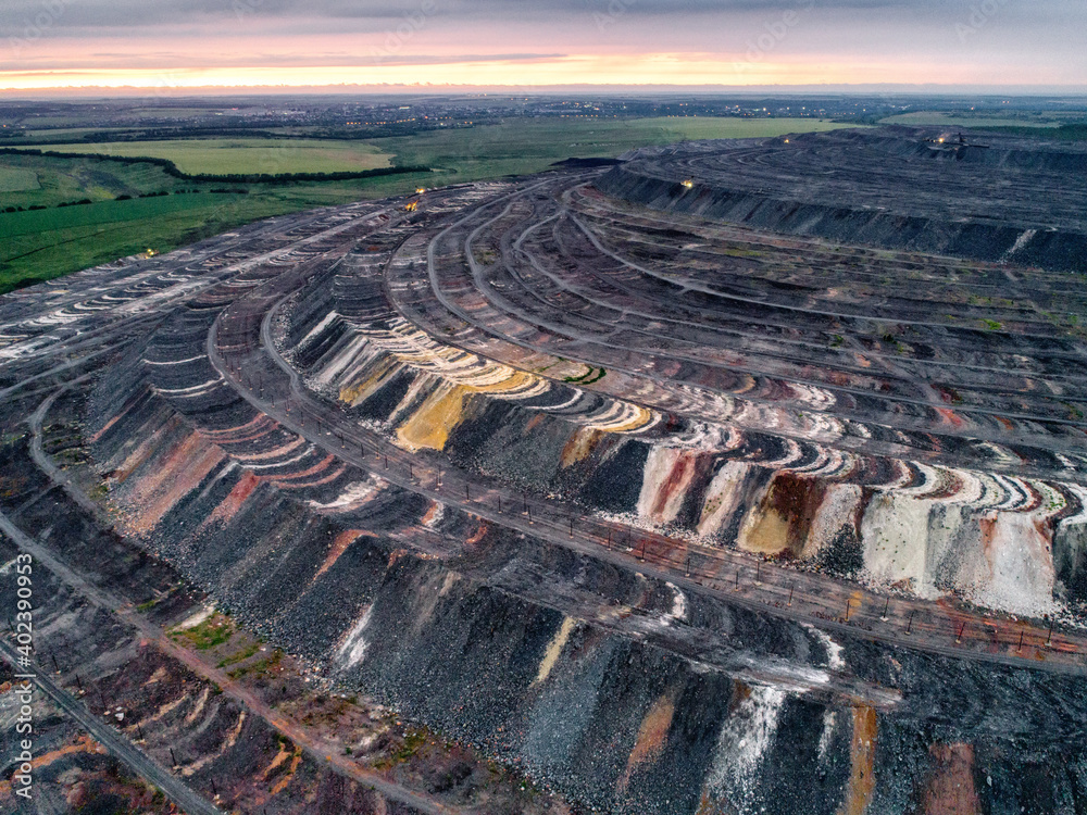 Huge mound of waste rocks. Industrial dump of a mining quarry ...