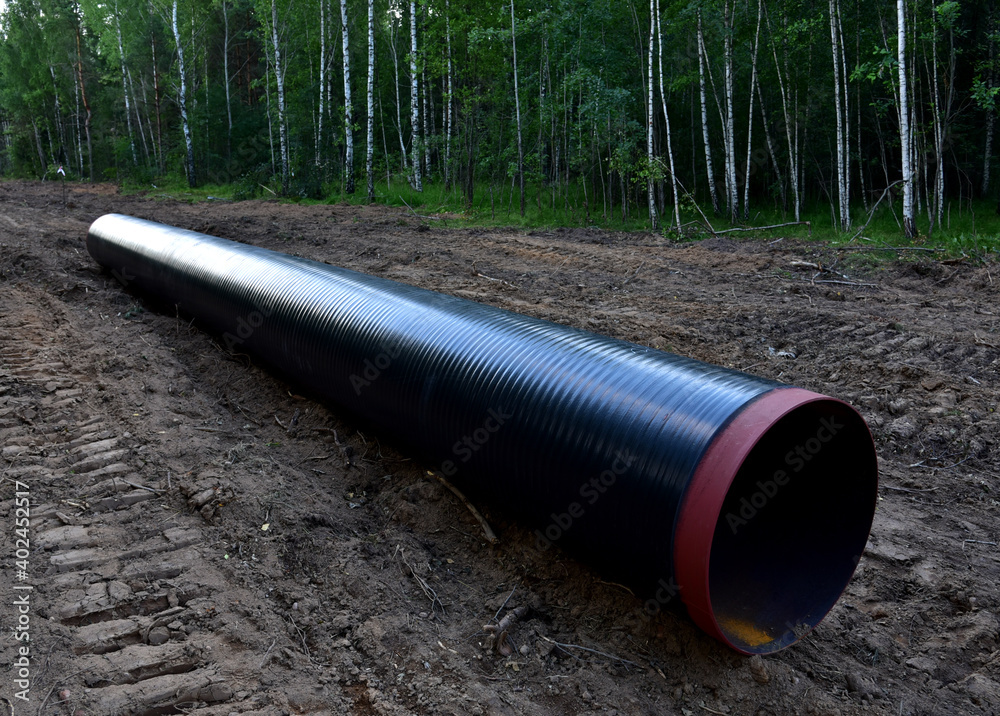 Crude oil and Natural gas pipeline construction work in forest area ...
