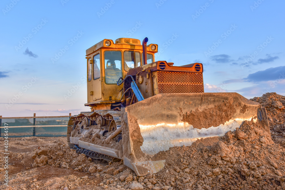 Dozer working at construction site. Bulldozer for land clearing ...