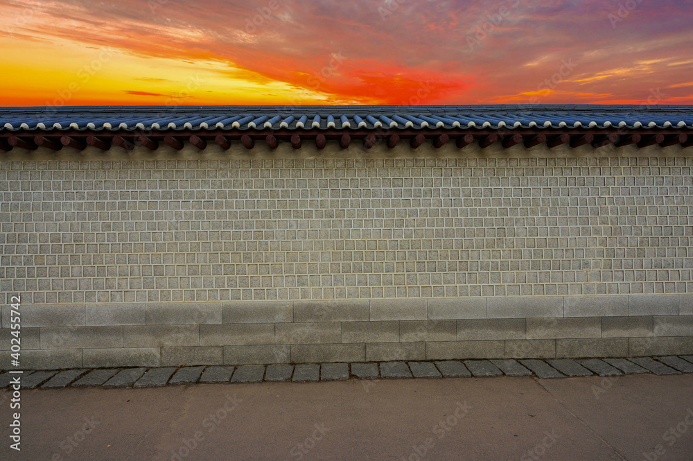 Gray brick wall ancient architecture and Asian black roof construction ...