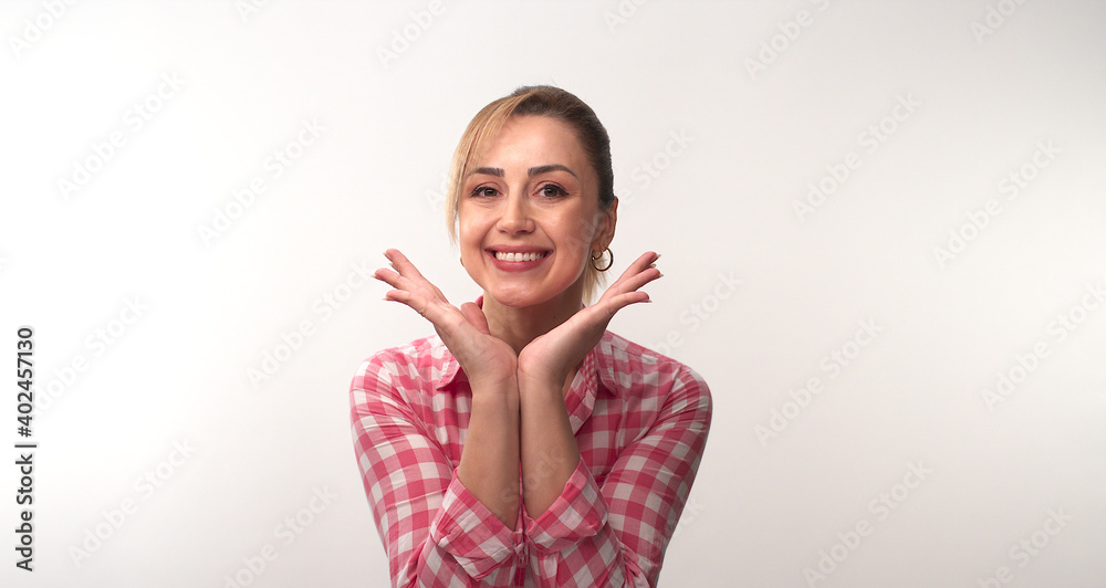 Woman holds cheeks with surprise hand. Beautiful blond hair woman. To ...