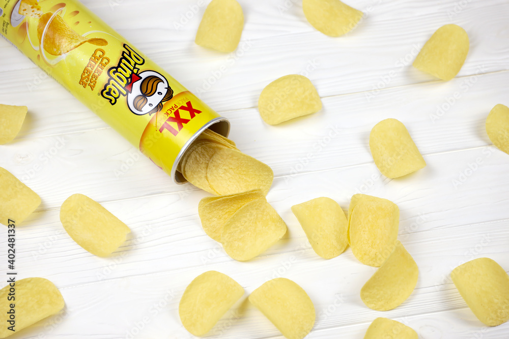 Pringles cheesy cheese flavour. Cardboard tube can with Pringles potato ...