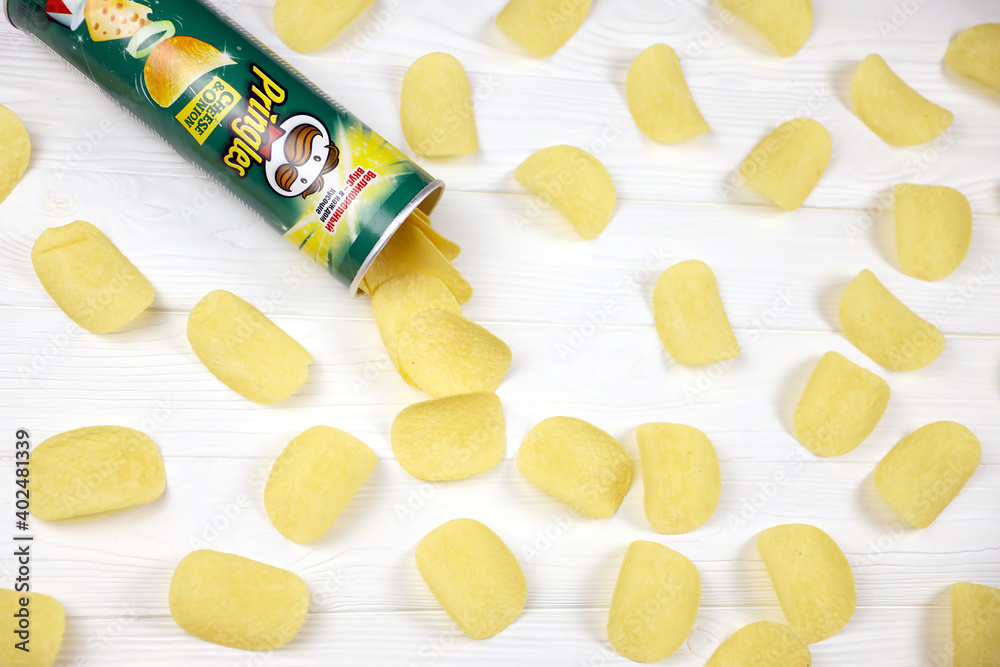 Pringles cheese onion flavour. Cardboard tube can with Pringles potato ...