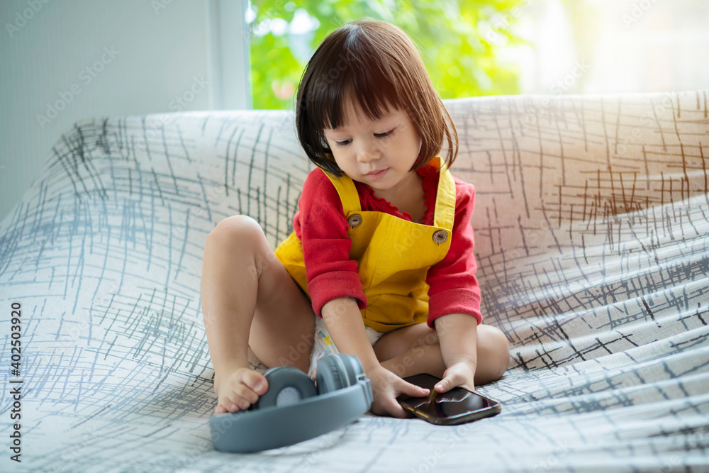 child girl happy look smart phone. asian child. Child development ...