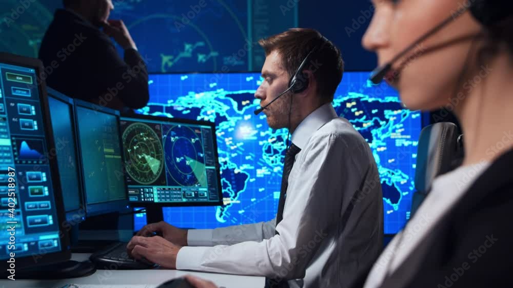 Workplace of the air traffic controllers in the control tower. Team of ...