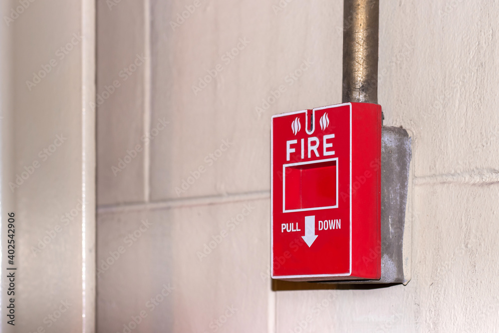 Manual pull down station placed on wall for fire alarm system in case ...