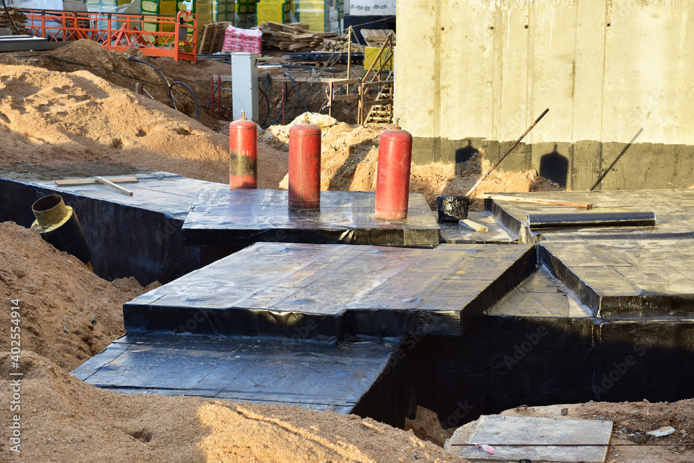 Painting bitumen at concrete wells, сhambers, manholes and pump station ...