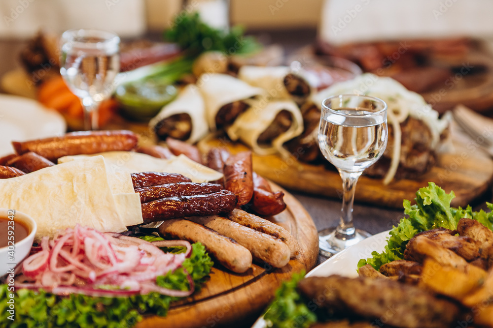 large and generously covered with delicious dishes table on which there ...