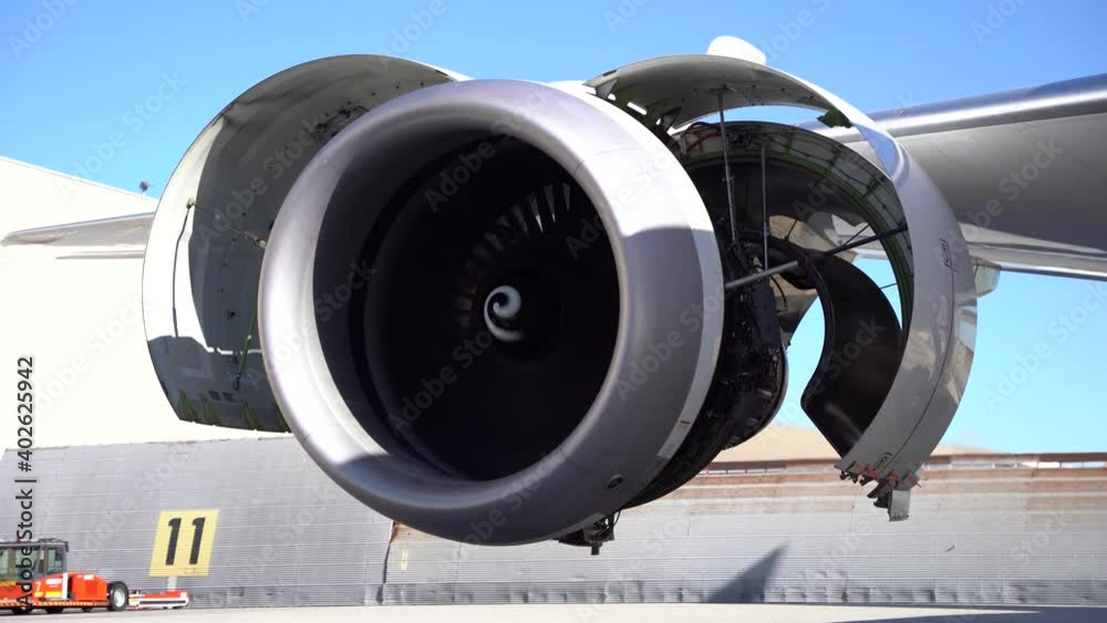 Close up of a jet engine on a commercial plane being test run with the ...