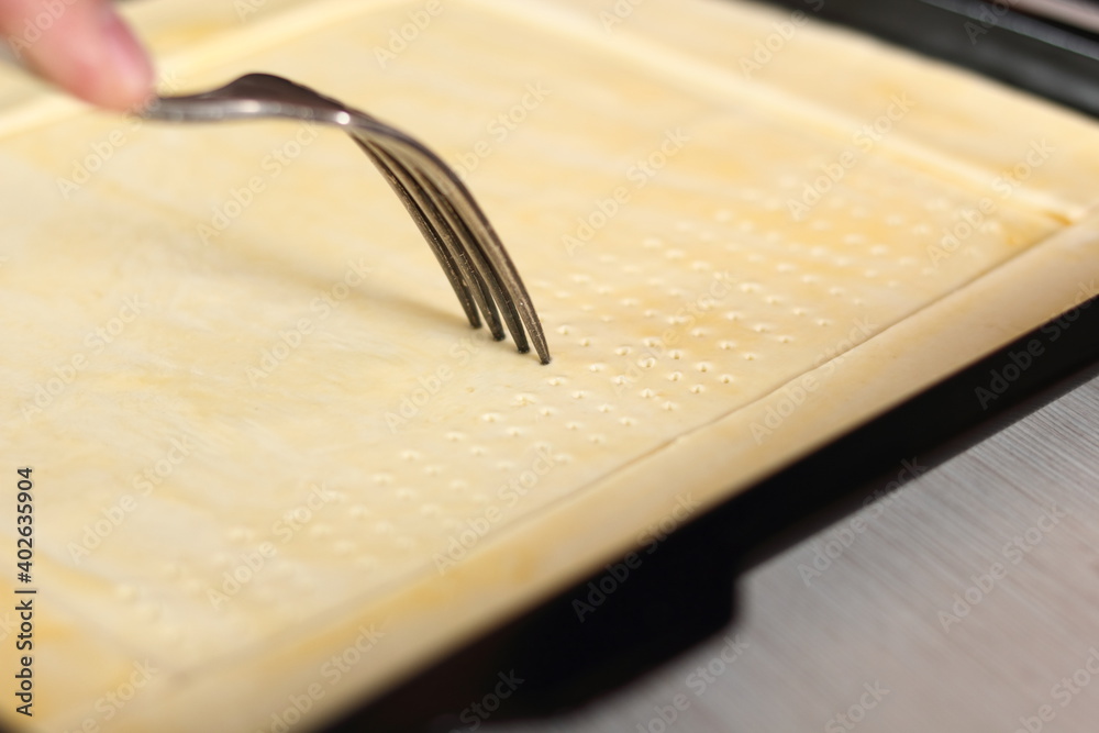 Prick base of puff pastry sheet with fork. Making Chicken and Egg ...