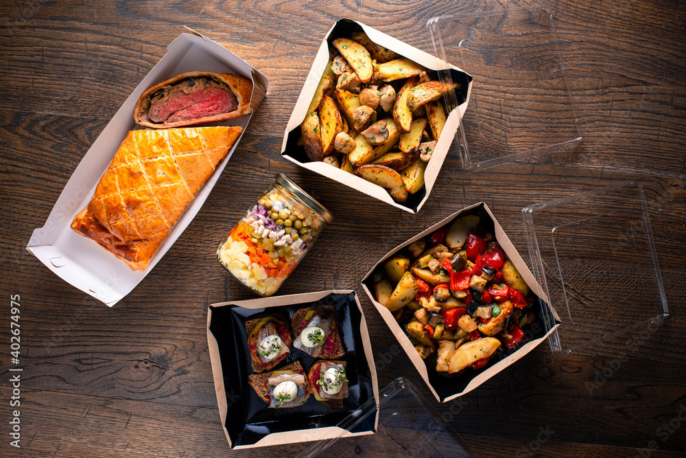 Healthy food delivery. Take away vegetables, meat in boxes. Top view ...