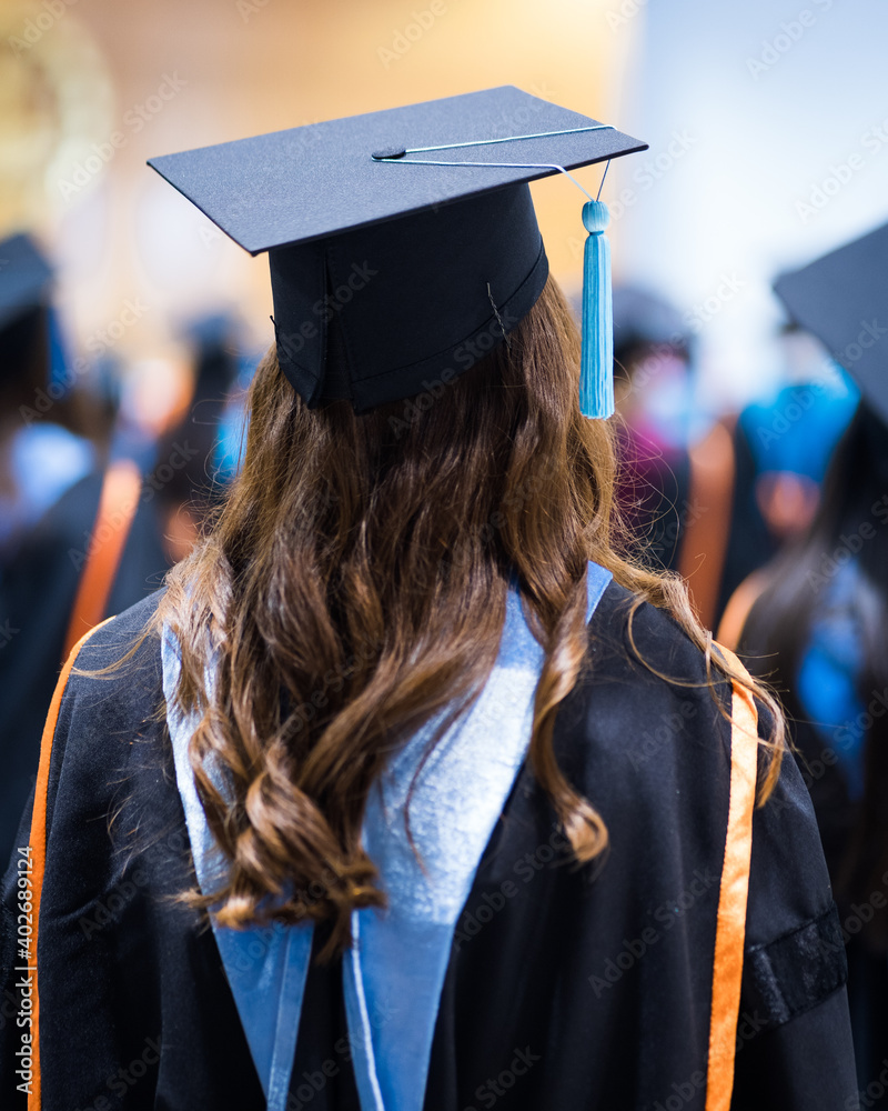Rearview of the university graduates line up for degree award in ...