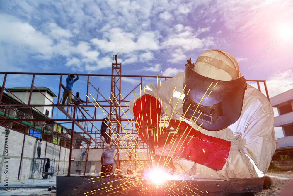 Welder man worker welding process with spark light in construction ...