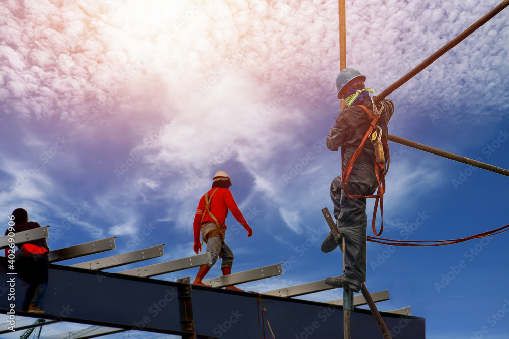 Workers on the high scaffolding wear equipment protective safety ...