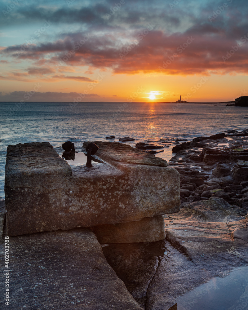 Sunrise over the remains of Old Salt Works at Seaton Sluice on the ...