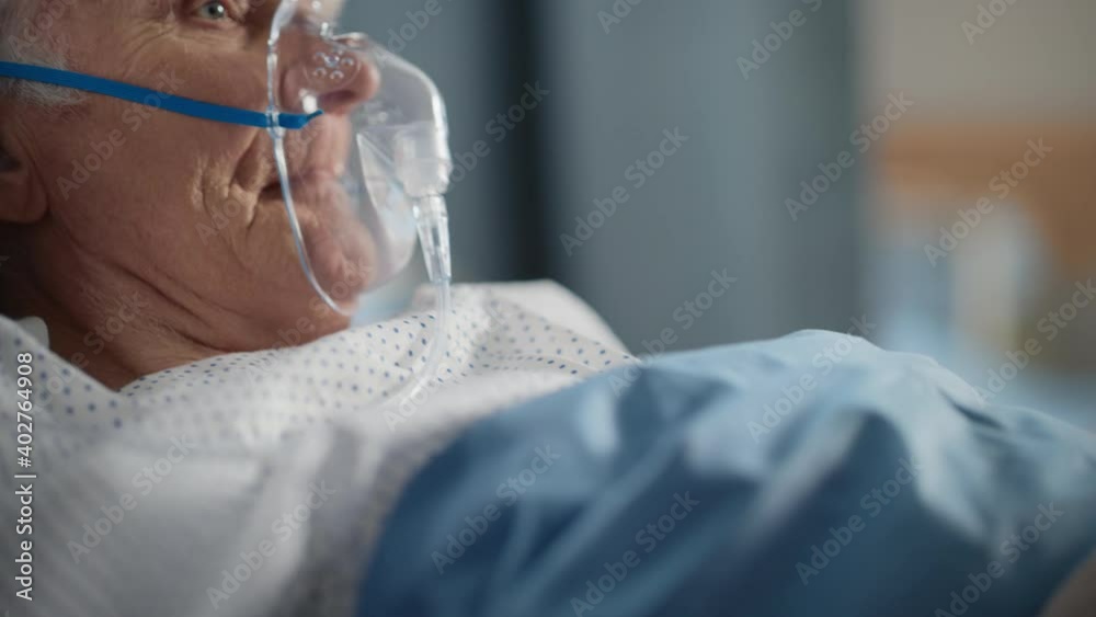 Hospital Ward: Portrait of Elderly Man Wearing Oxygen Mask Resting in ...
