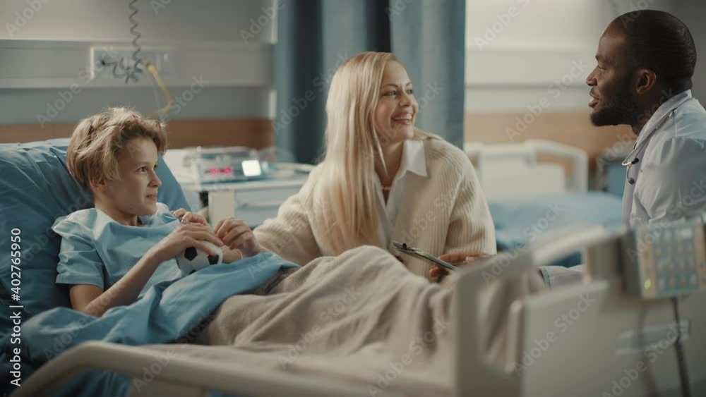 Hospital Ward: Handsome Young Boy Resting in Bed with Caring Mother ...