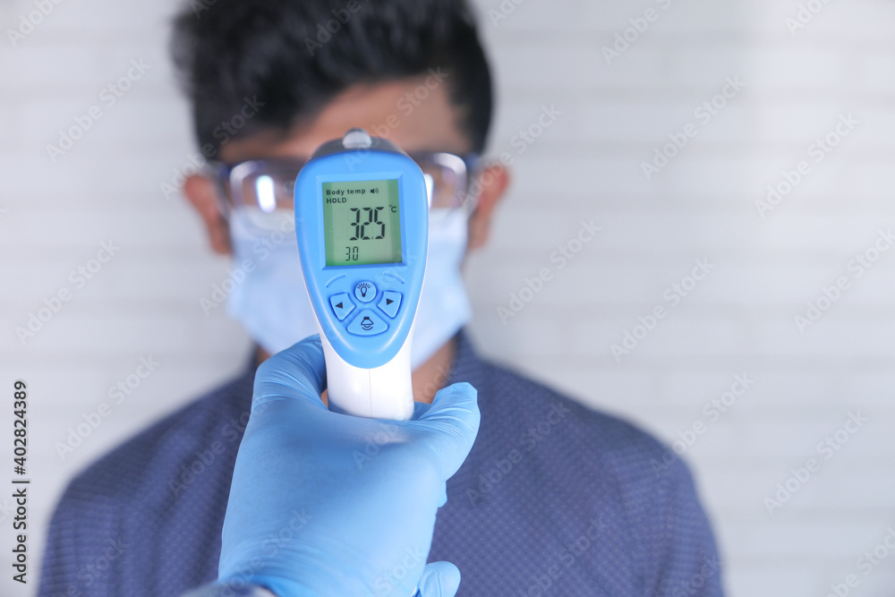 doctor hand with thermometer checking temperature of a man Stock Photo ...
