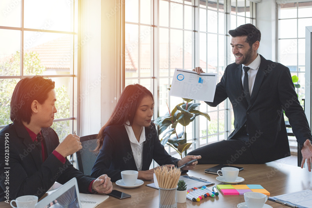 Caucasian businessman show presentation chart to co-worker at working ...