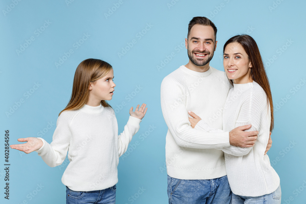 Worried perplexed young parents mom dad with child kid daughter teen ...