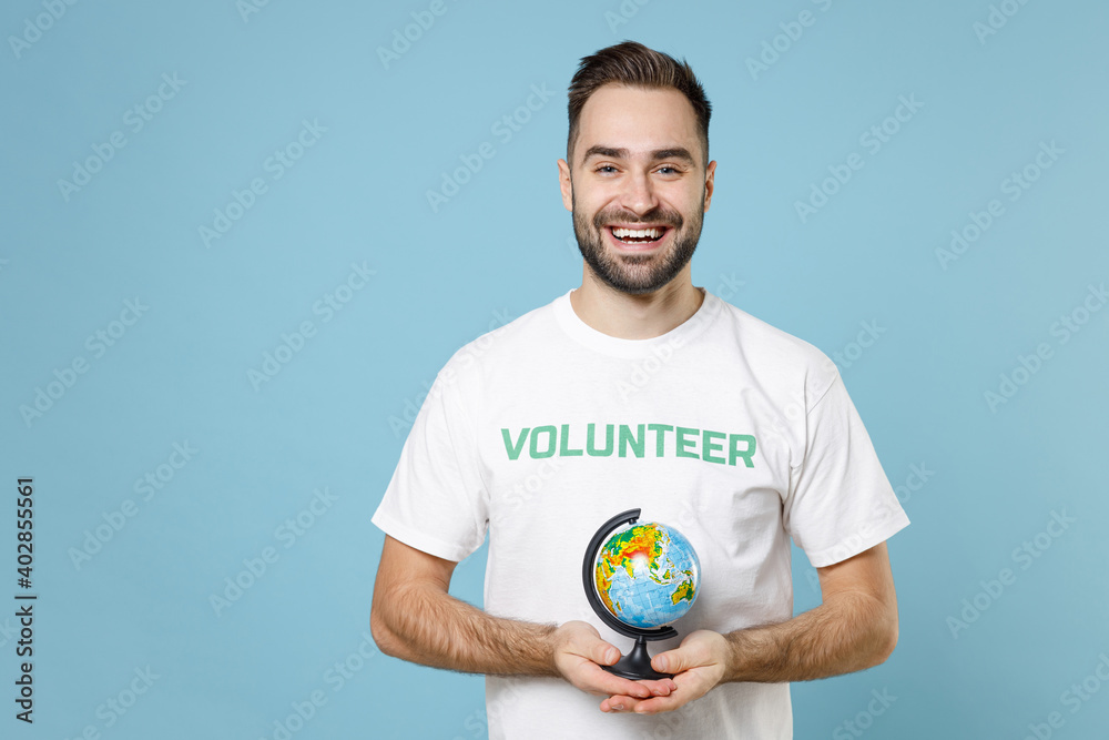 Cheerful smiling young man 20s wearing white volunteer t-shirt hold ...