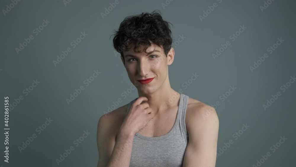 Video „Portrait of handsome androgynous man with makeup sending air ...