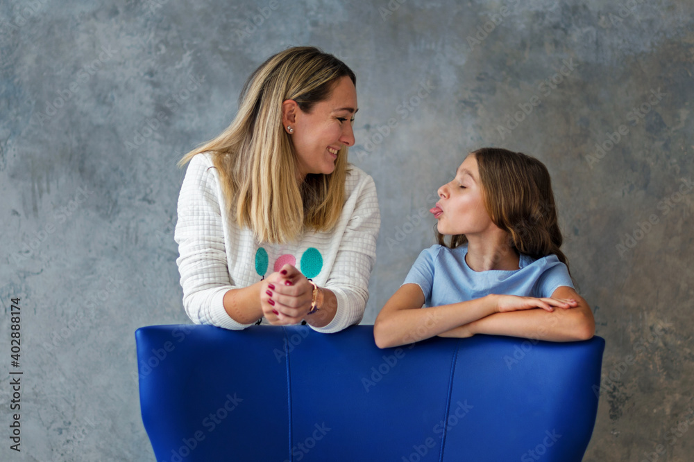 Teenage girl with her mother. Gentle relationship with the child and ...