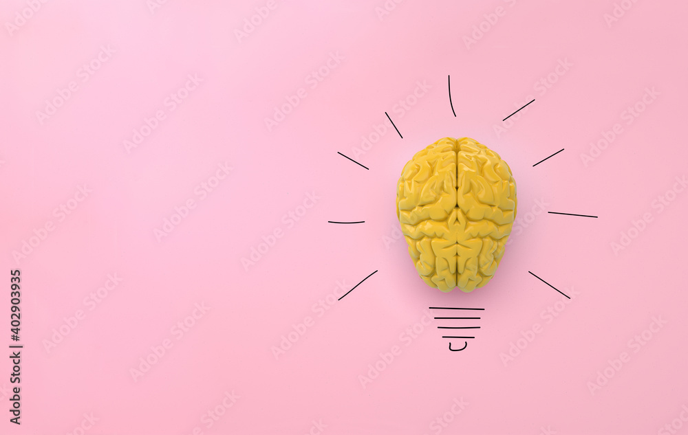 Yellow brain on pink background, concept light bulb idea with pencil ...