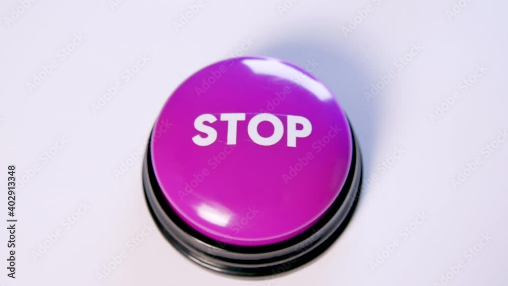 Woman pushing a Stop button, close up. Finger pressing button to pause ...