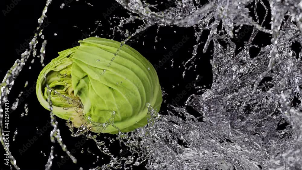 Realistic render of a cabbage head hitting a water splash in super slow ...