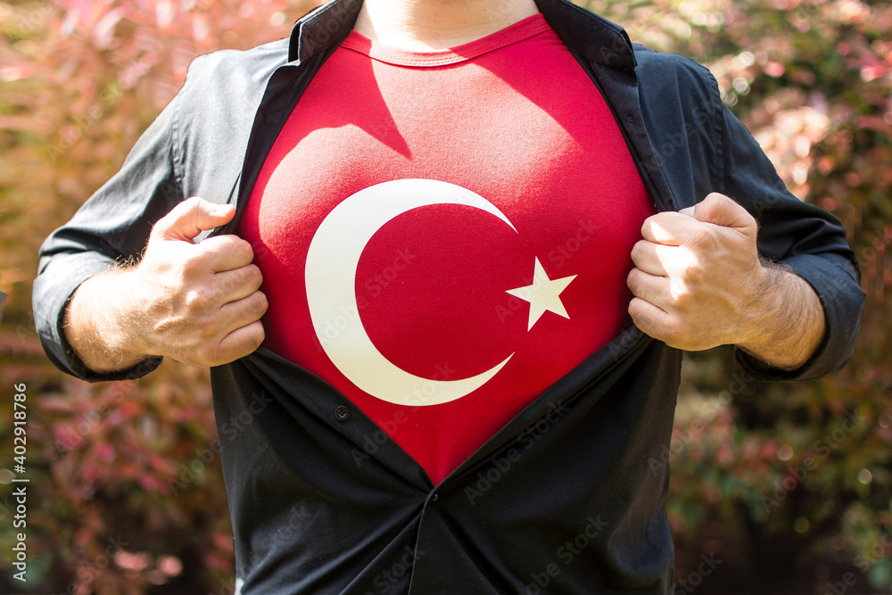 Young turk acting like a superhero and tearing off the shirt on his ...