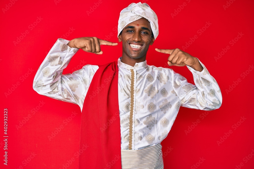 Handsome indian man wearing tradition sherwani saree clothes smiling ...