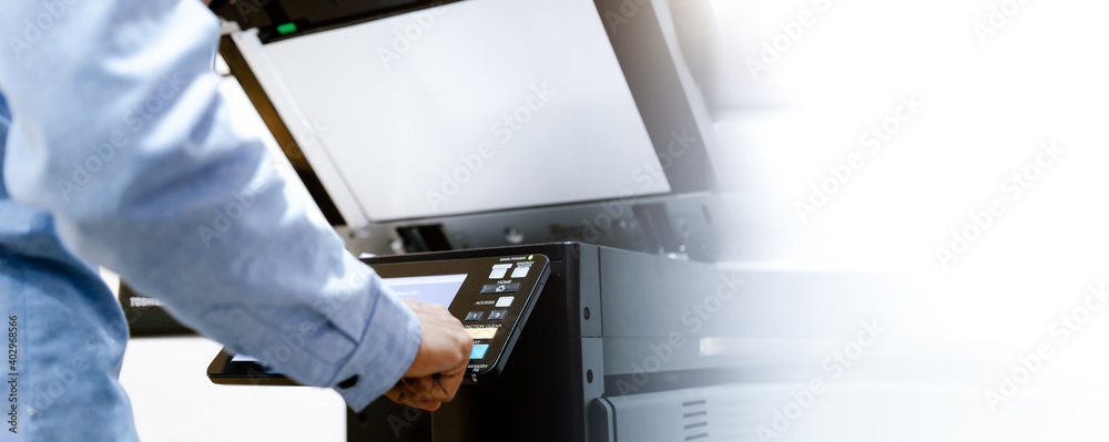 Bussiness man Hand press button on panel of printer, printer scanner ...
