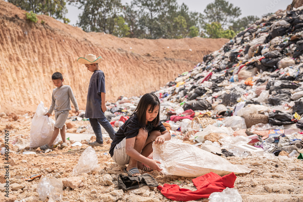 Foto de Child labor. Children are forced to work on rubbish. Poor ...