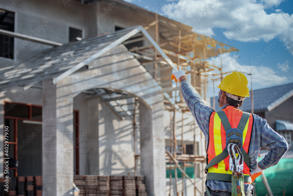 Asian men wearing safety clothing Construction worker helmets and ...