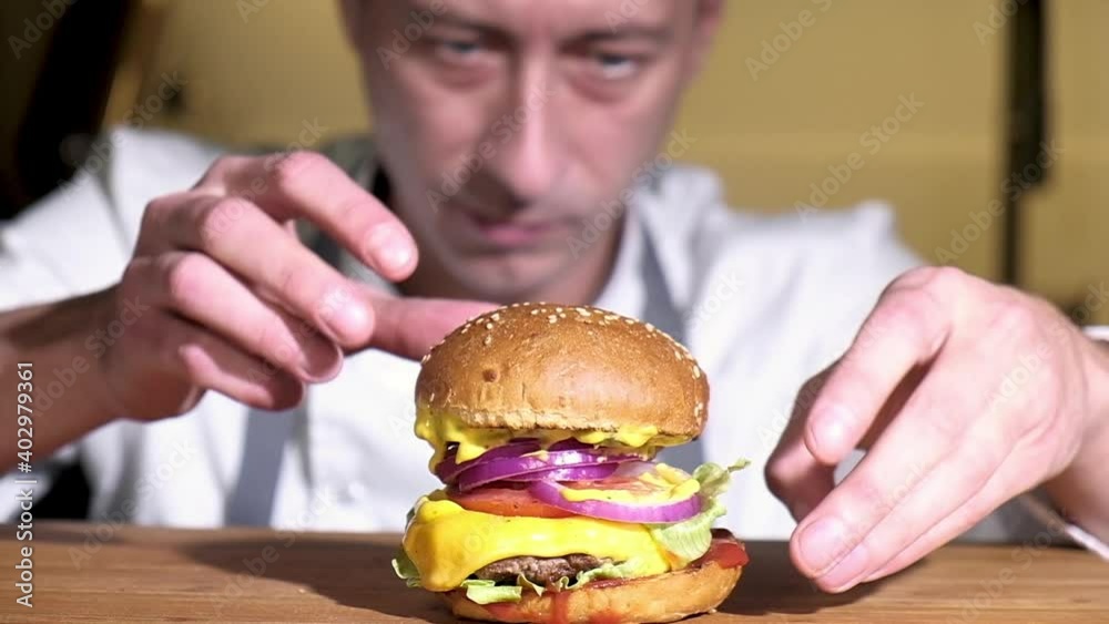 Cooking Yummy homemade burger. Chef makes delicious juicy burger beef ...