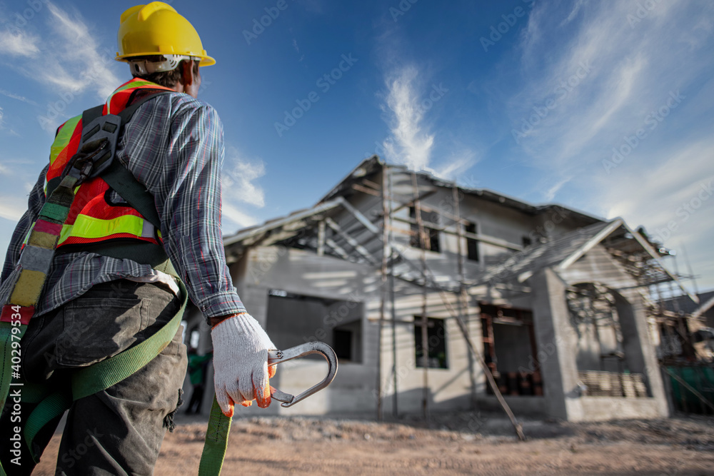 Asian men wearing safety clothing Construction worker helmets and ...