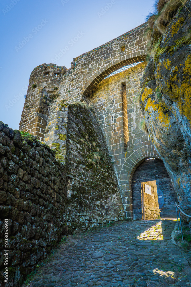 The fortified gate leads to the main court of the Fortress of Polignac ...