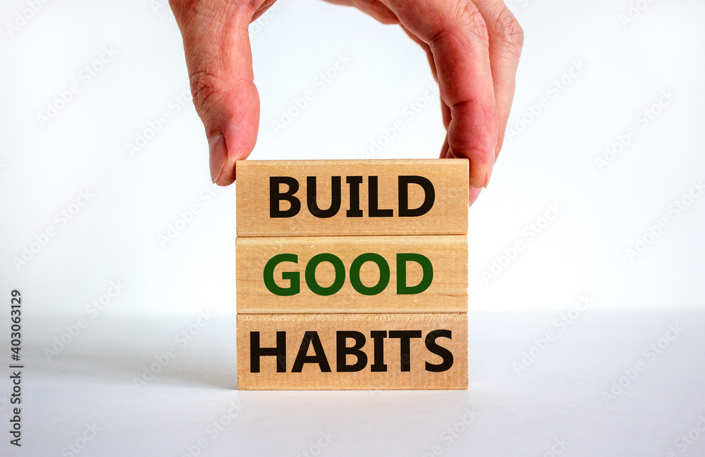 Build good habits symbol. Wooden blocks with words 'build good habits ...