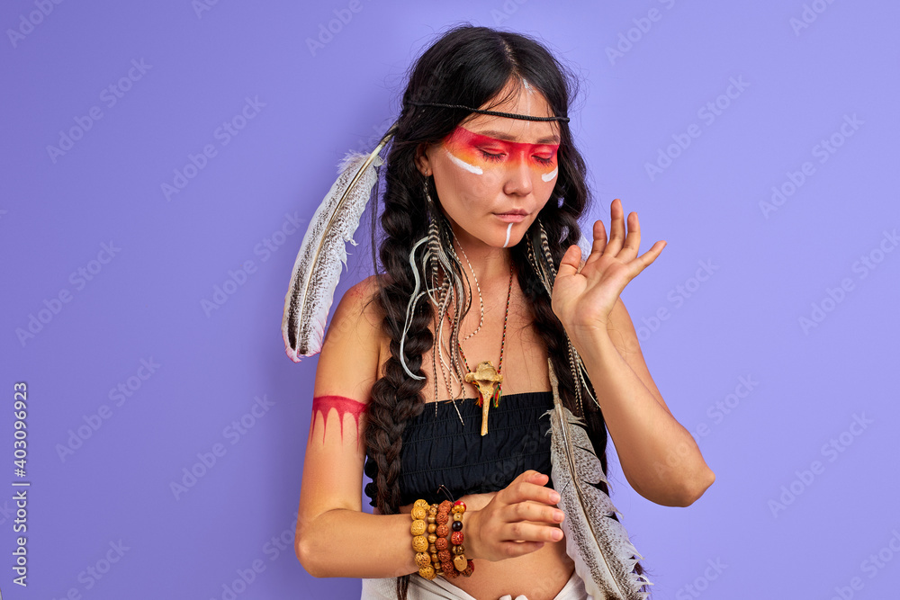 female with art native american creative warrior combat makeup in ...