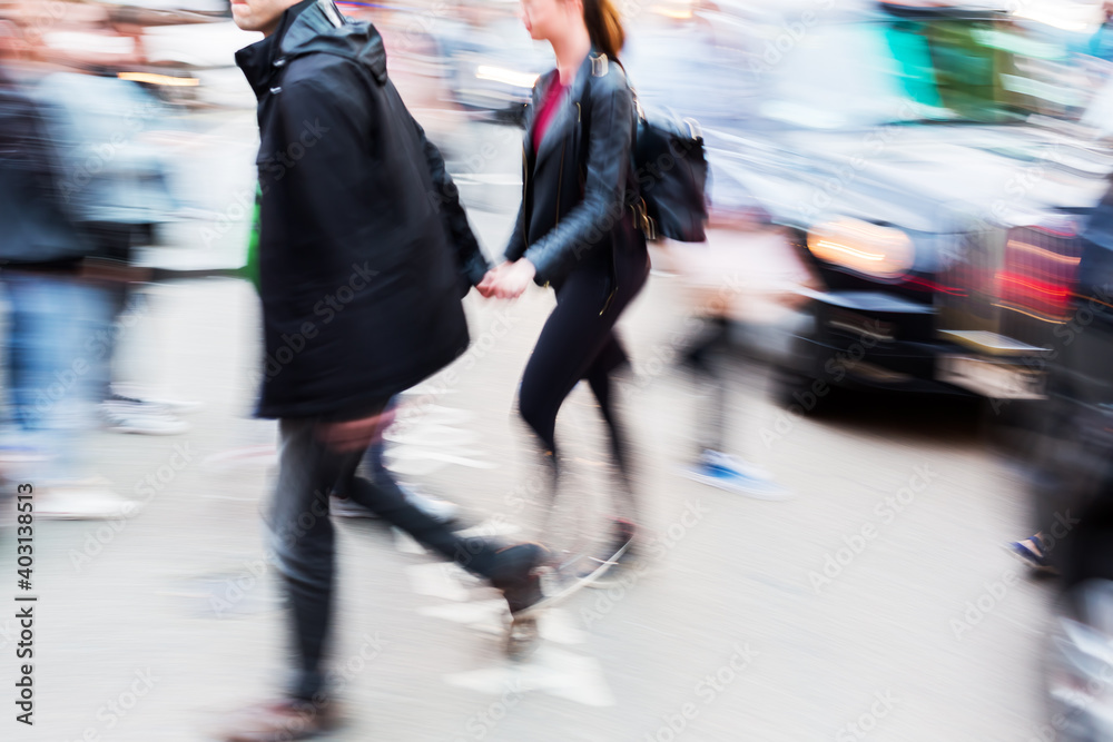 couple crossing a city street in motion blur Stock Photo | Adobe Stock