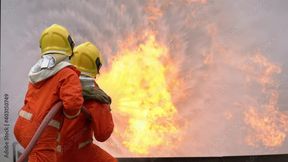 Vidéo Stock Firefighter teamwork in fire protection suit on safety ...