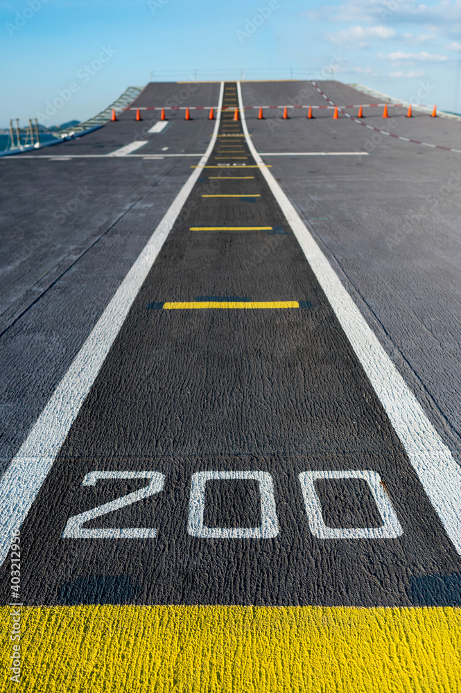 Number 200 on flight deck of aircraft carrier. Airplane runway on ...