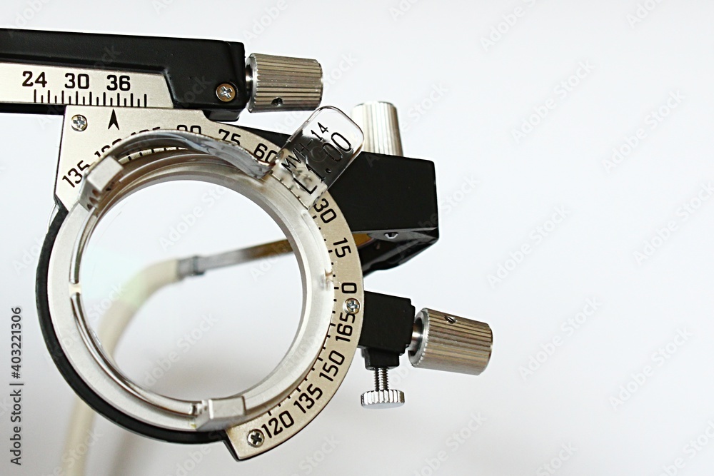 Optometric trial frame detail of left eye with inserted progressive ...