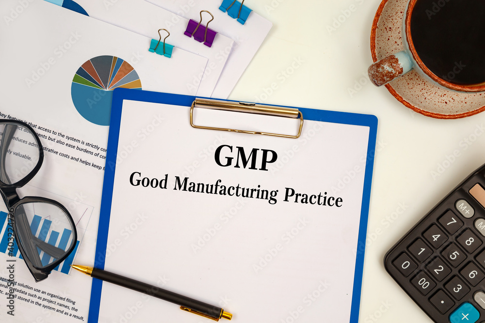 Paper with GMP Good Manufacturing Practice on the office desk Stock ...