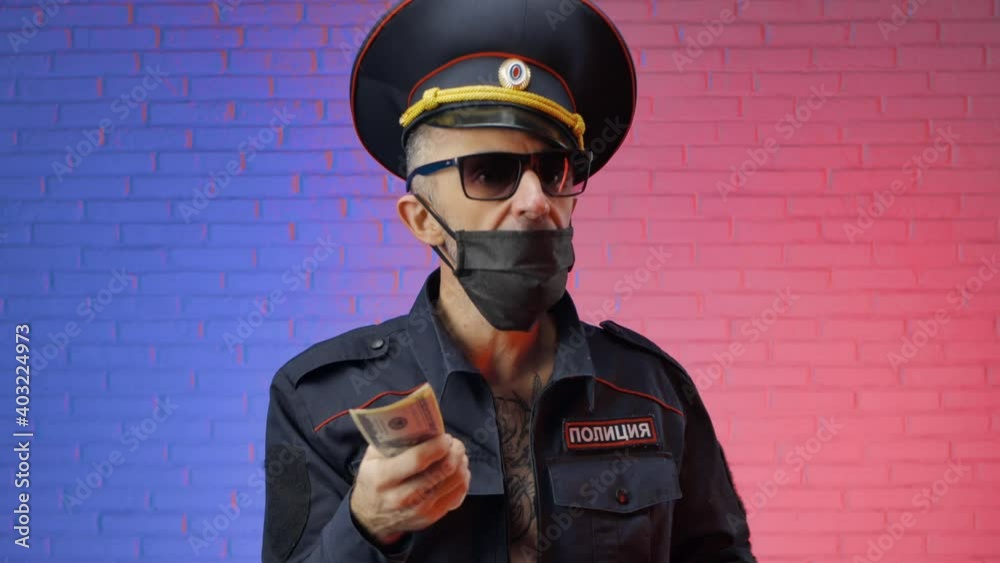 a man in a military uniform of the Russian police with a coronavirus ...